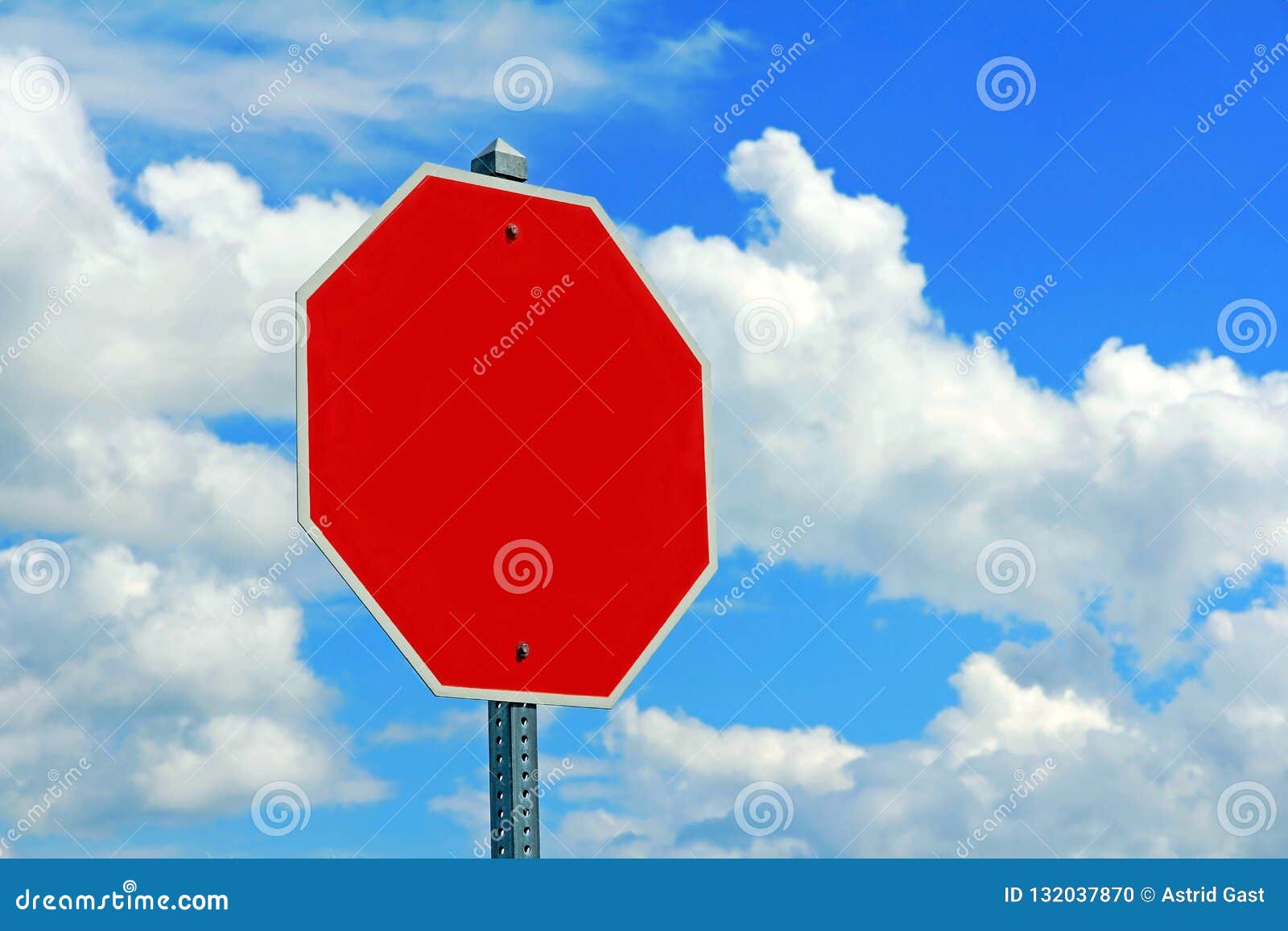 An Empty Red Shield Stop Shield Against a Blue Sky with Clouds Stock ...