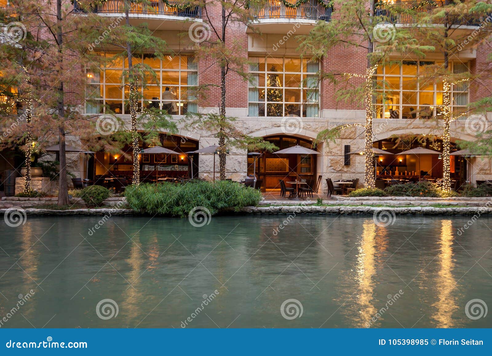 Empty Restaurant on the River with Cypress Trees Decorated with ...