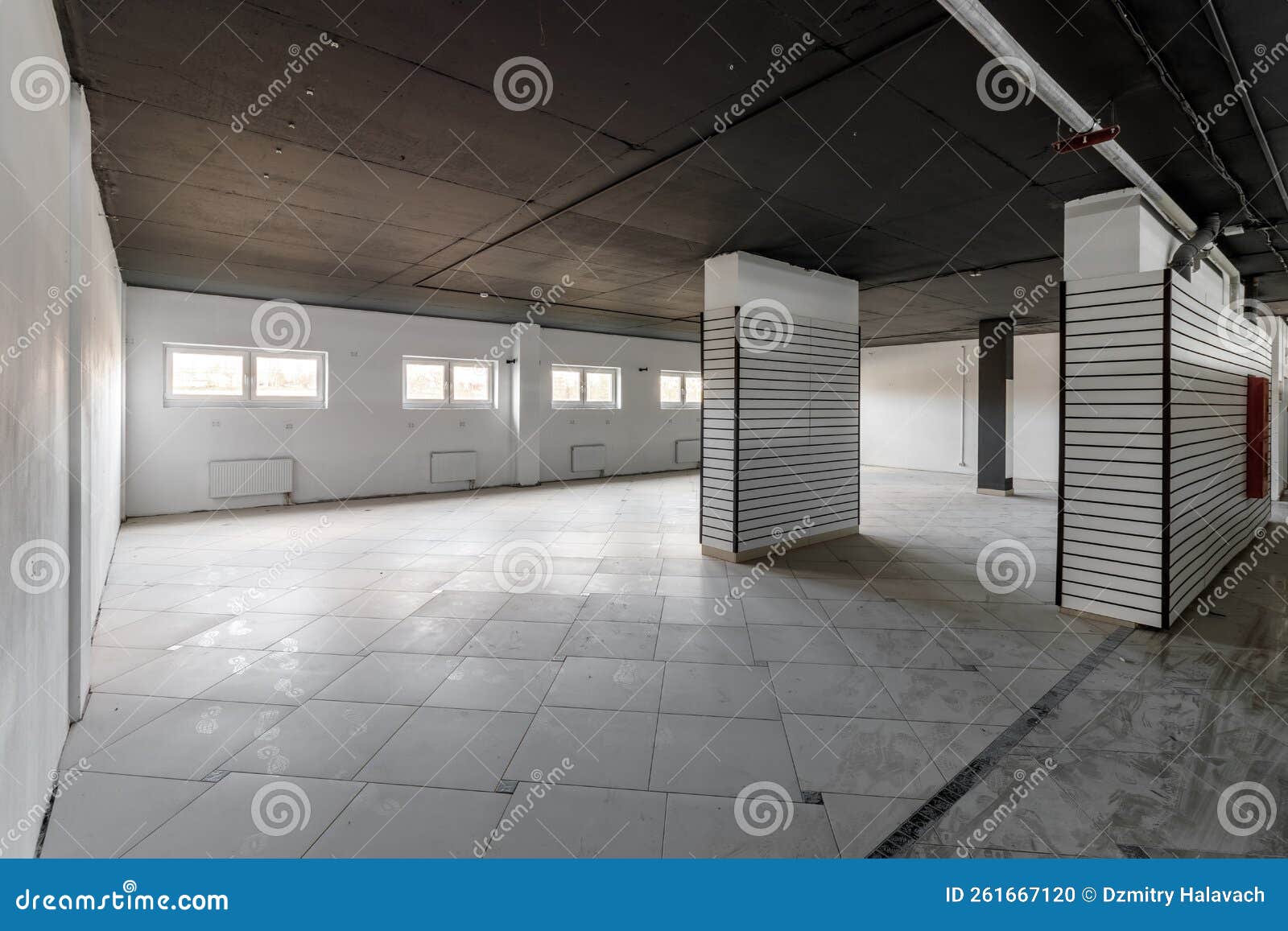 Empty Retail Space with a Black Ceiling and a Dirty Floor, Immediately ...