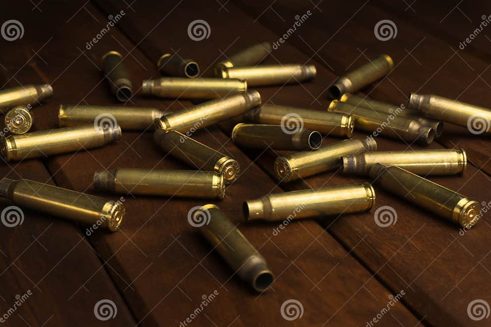 Empty Rifle Shells on Dark Wooden Board Stock Image - Image of shooting ...