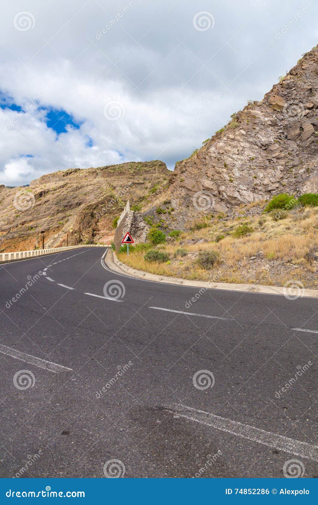 Empty Road and Falling Rocks Warning Sign Stock Photo - Image of ...