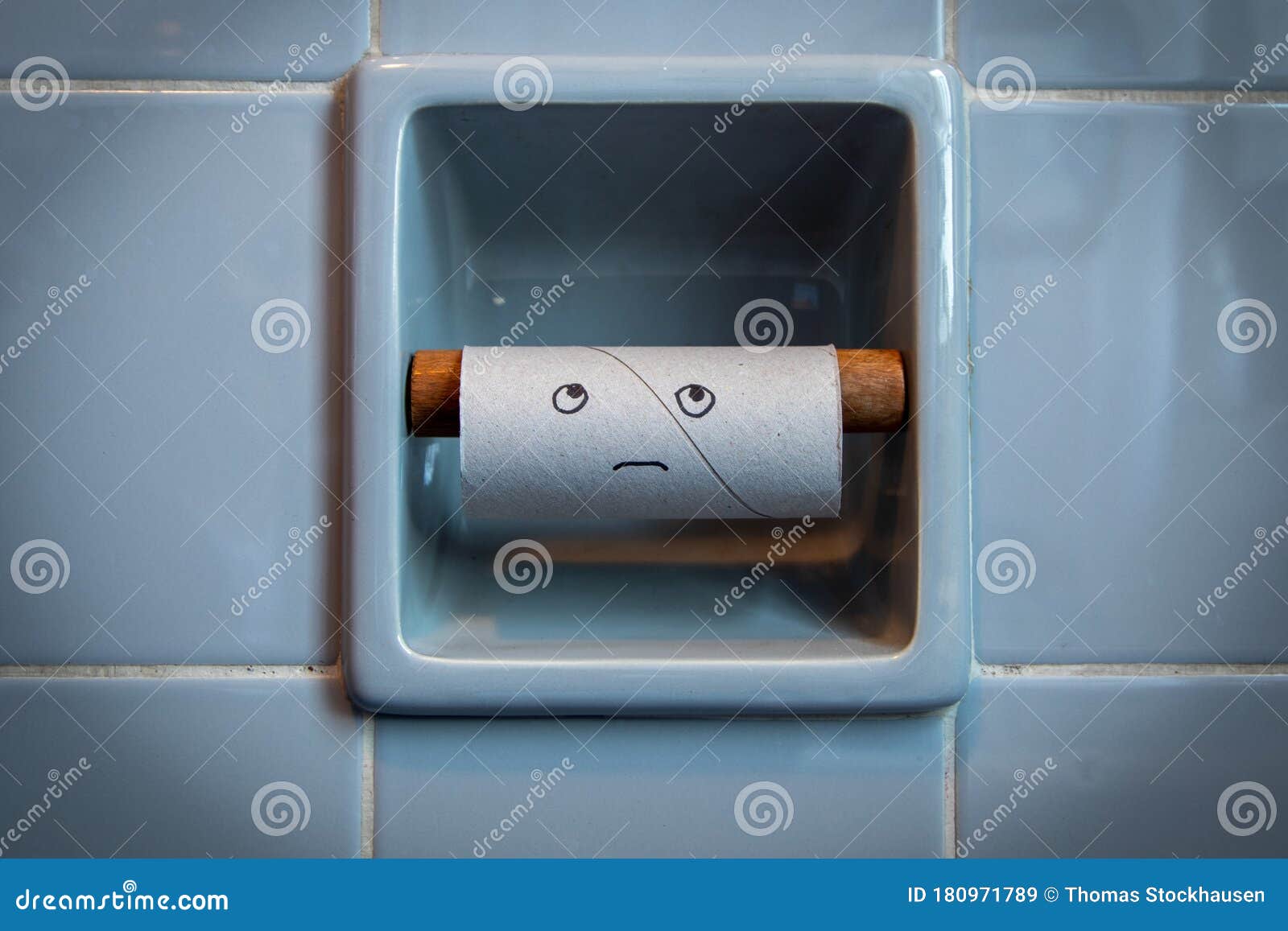 Empty Roll of Toilet Paper with Sad Face in a Toilet Paper Holder Stock ...