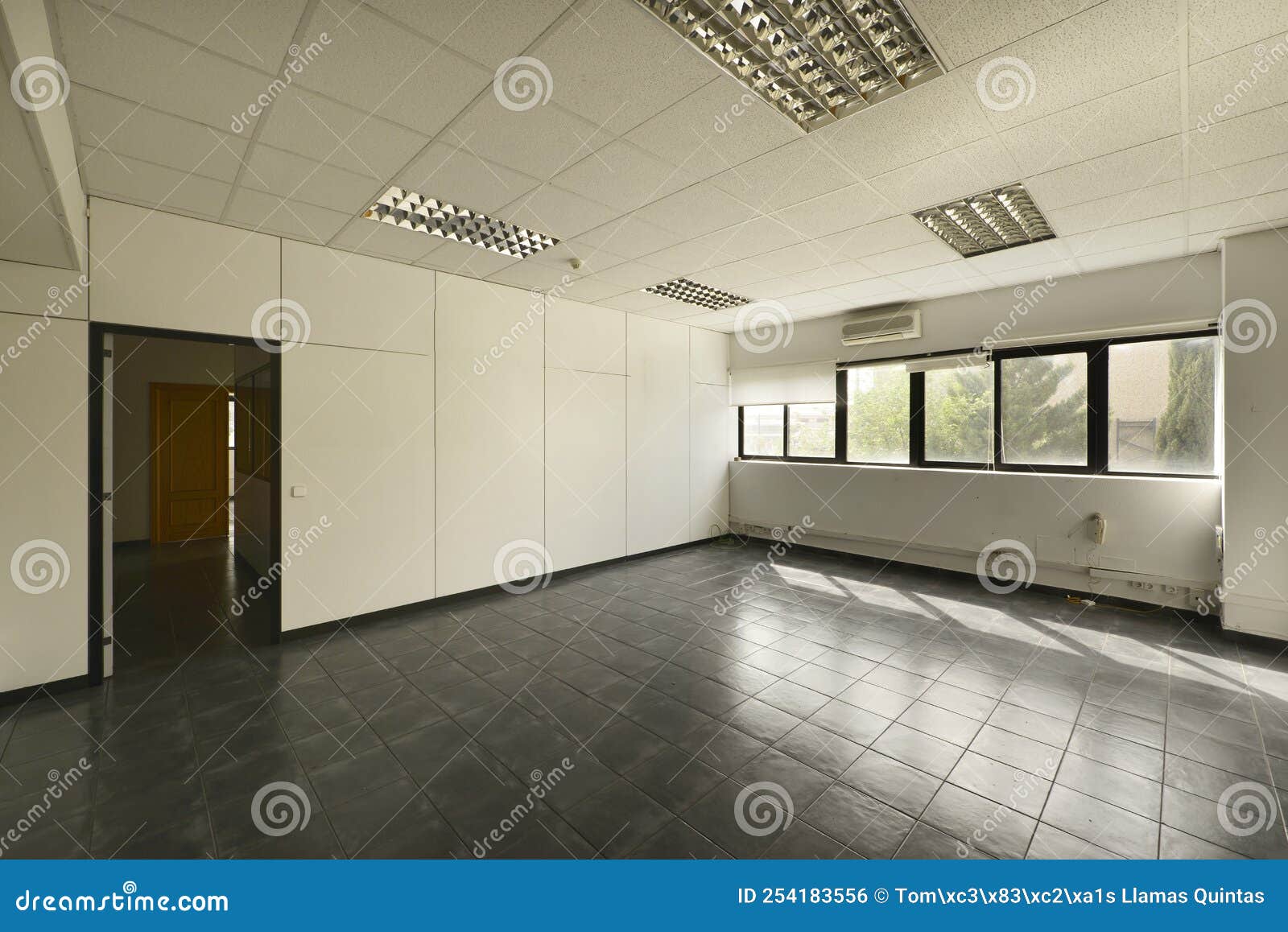 Empty Room with Gray Stoneware Floors, Wall Covered with Windows and ...