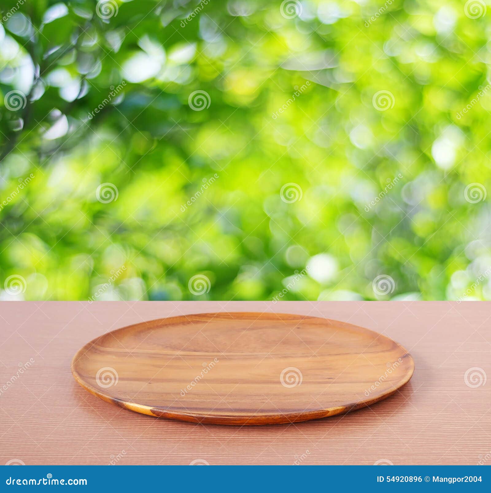 Empty Round Wooden Tray on Table Over Blur Tree Background Stock Photo ...