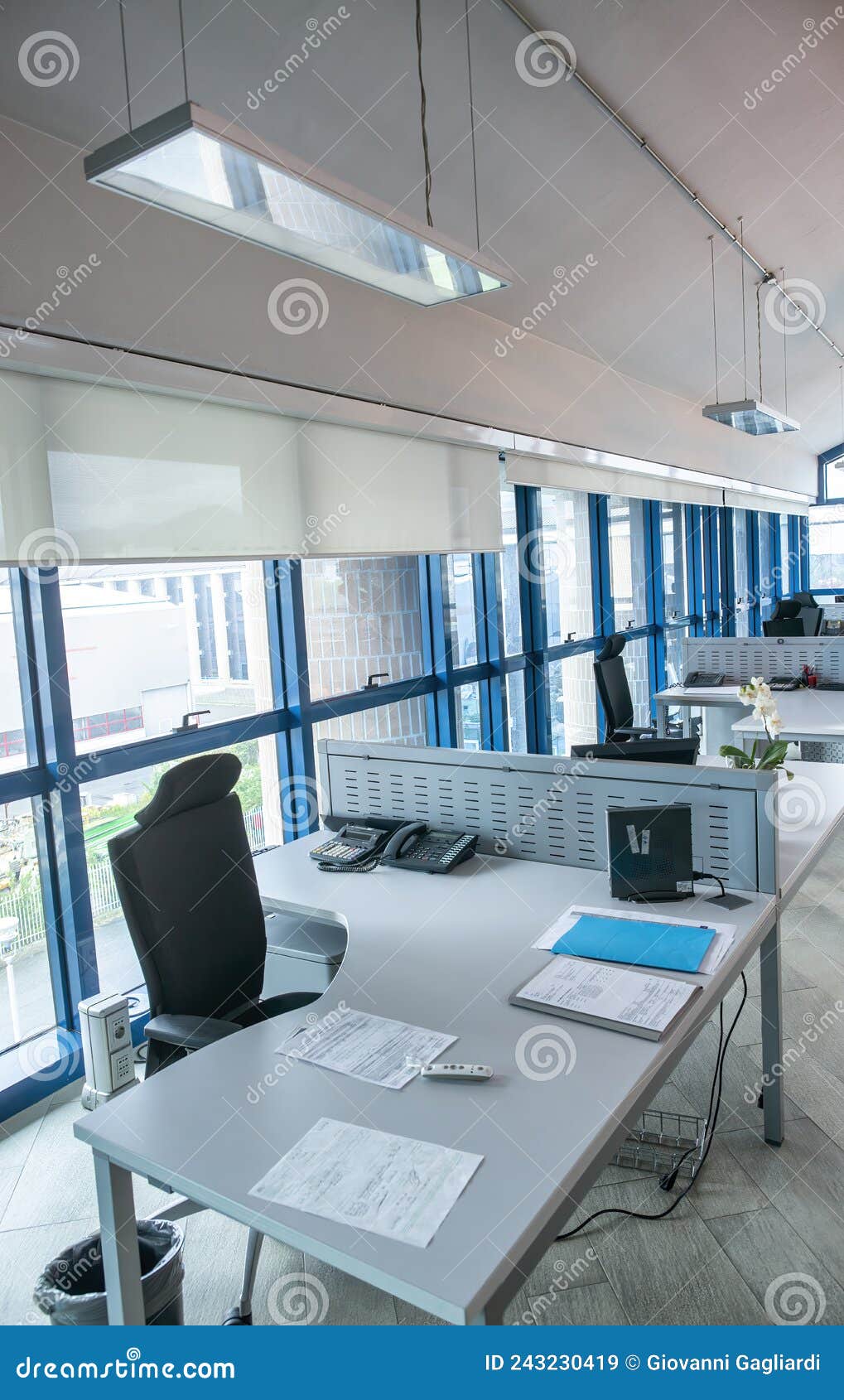 Empty Row of Desks and Chairs in the Modern Office Building Stock Image ...