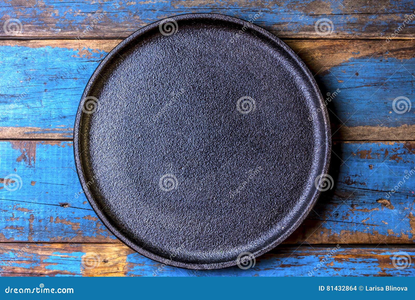Empty Rustic Black Plate Over Wooden Blue Background Stock Photo ...