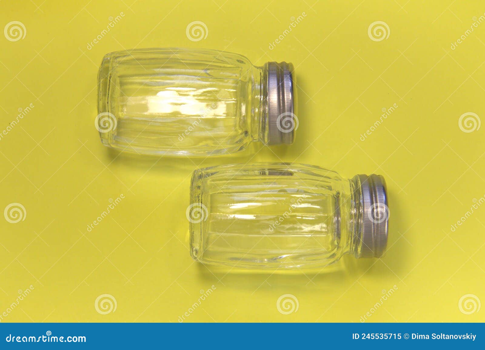 Empty Salt Shakers. on a Yellow Background. Stock Image - Image of ...