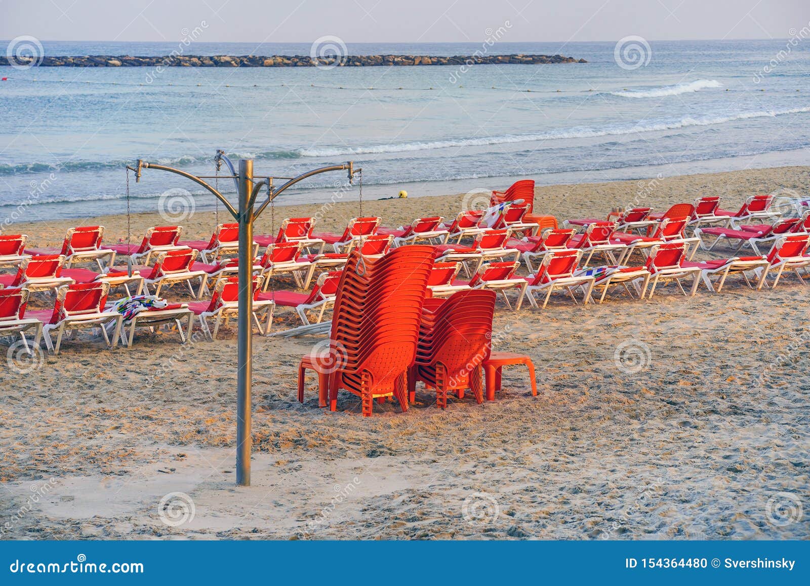 Empty beach with sun beds stock photo. Image of beautiful - 154364480