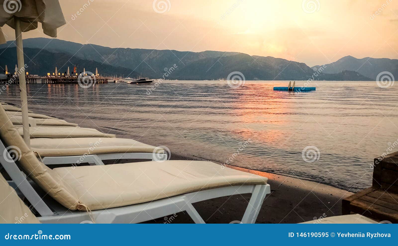 Empty Sea Beach with Rows of Sunbeds at the Sunset Stock Image - Image ...