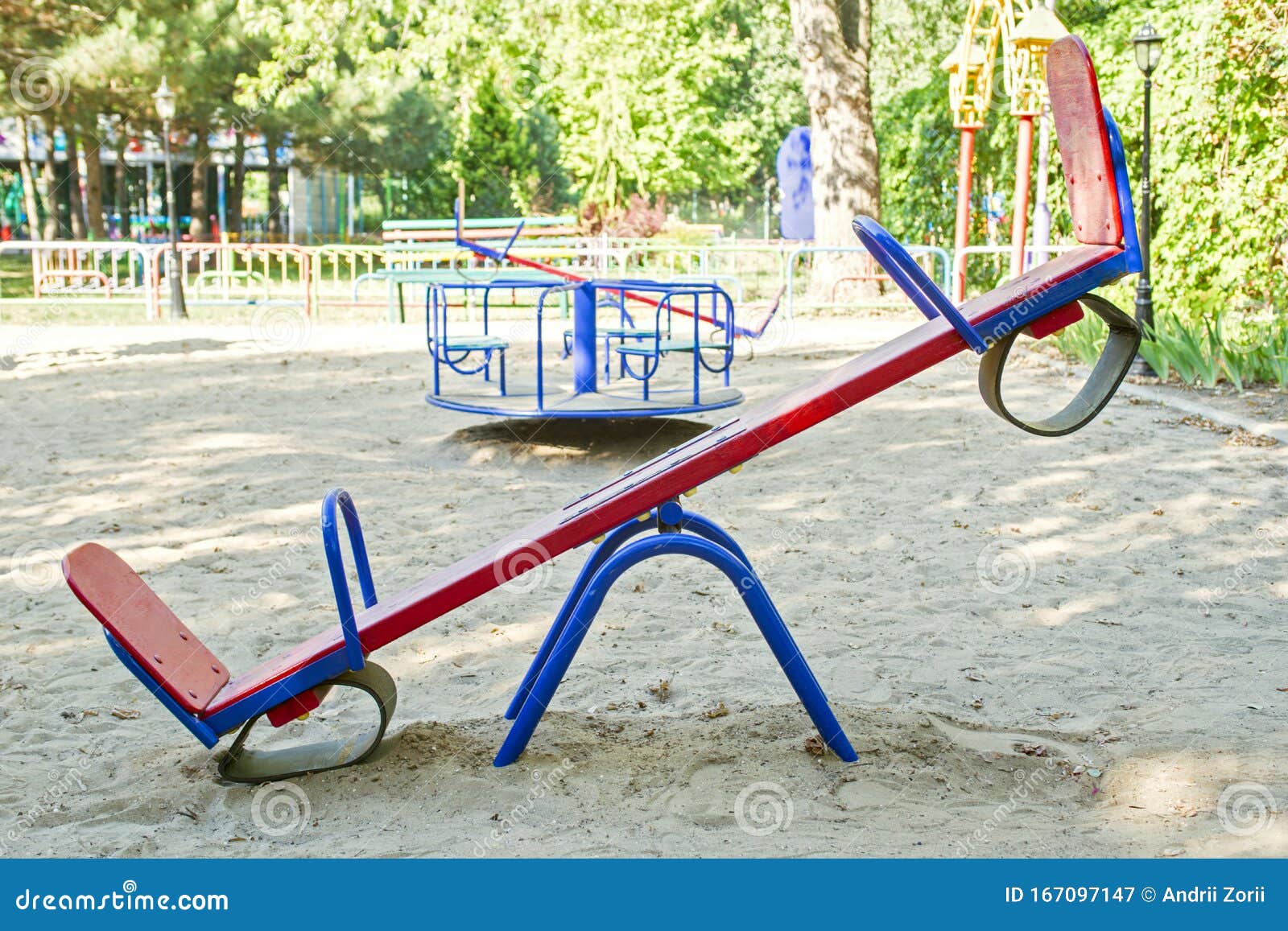 Empty Seesaw on Playground in Public Park. Wooden Seesaw in the Park ... Empty Seesaw on Playground in Public Park. Wooden Seesaw in the Park ...