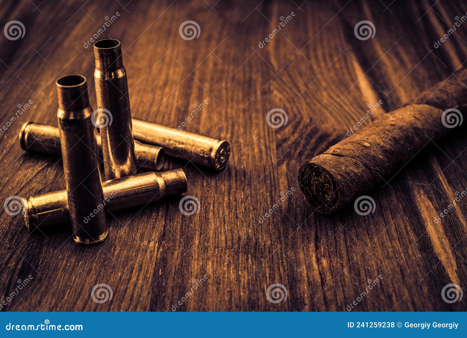 Empty Shells from the Rifle and Cuban Cigar Lying on a Wooden Table ...