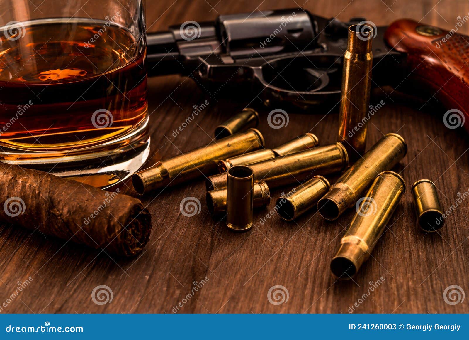 Empty Shells from the Weapons with Glass of Whiskey and Revolver with ...
