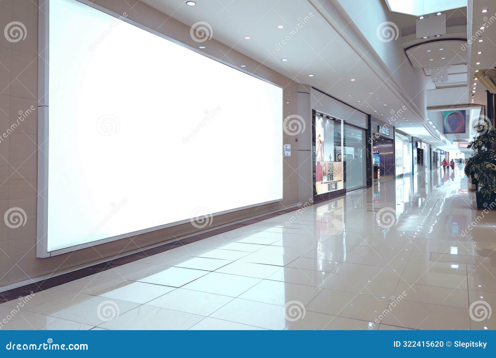 An Empty Shopping Mall Corridor with a Large, Illuminated Blank ...