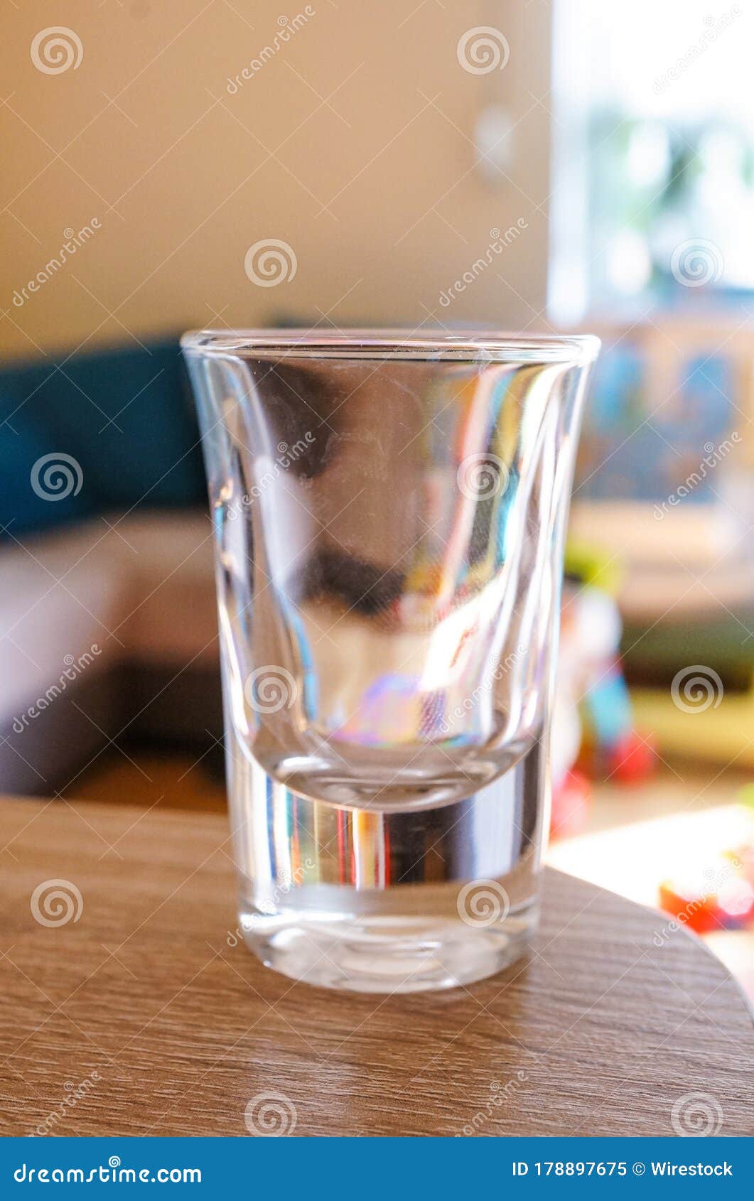 Empty Shot Glass on a Wooden Kitchen Table Stock Image - Image of ...