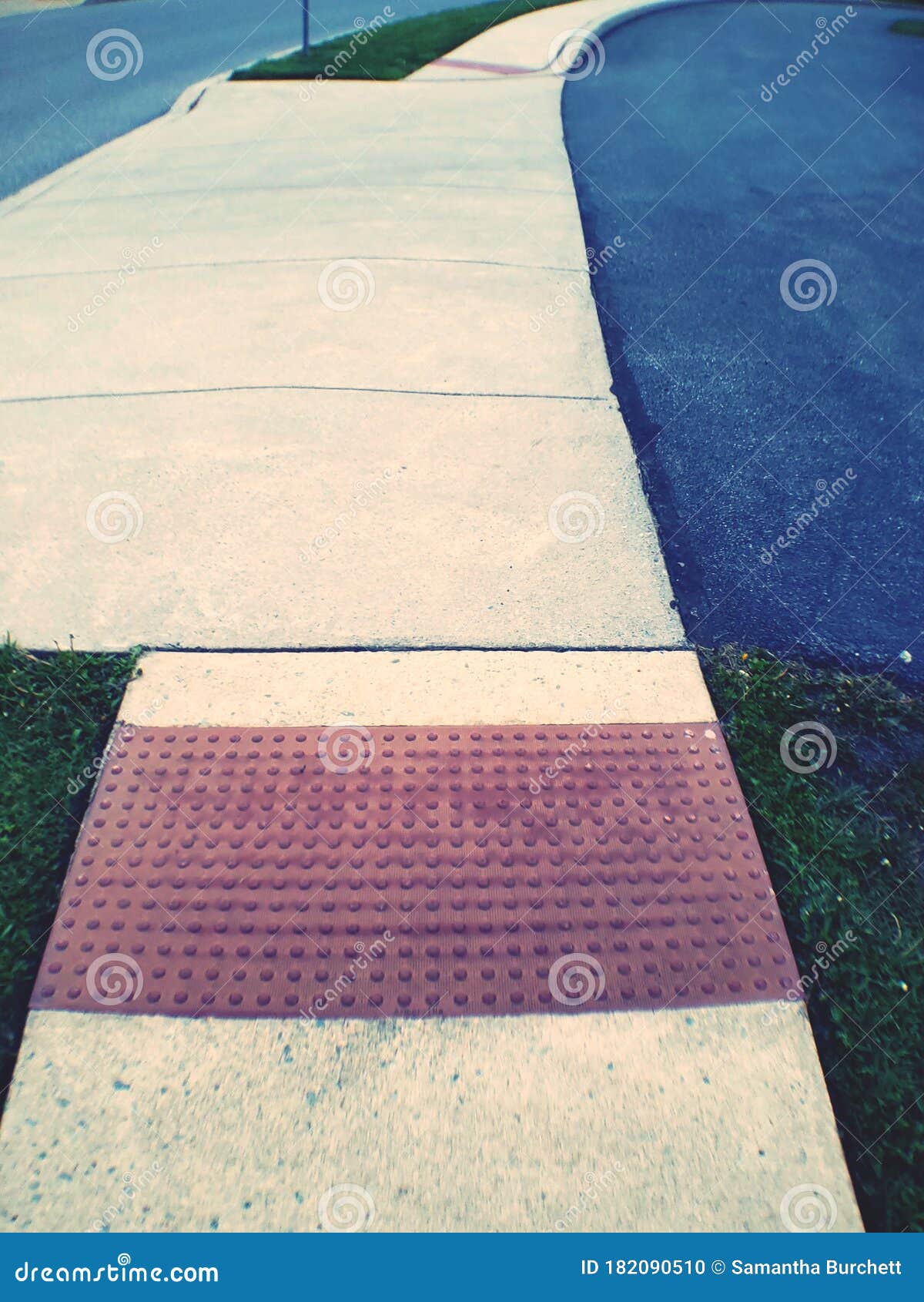 A Empty Sidewalk with Red Bumpy Steps Crossing a Empty Road Stock Photo ...