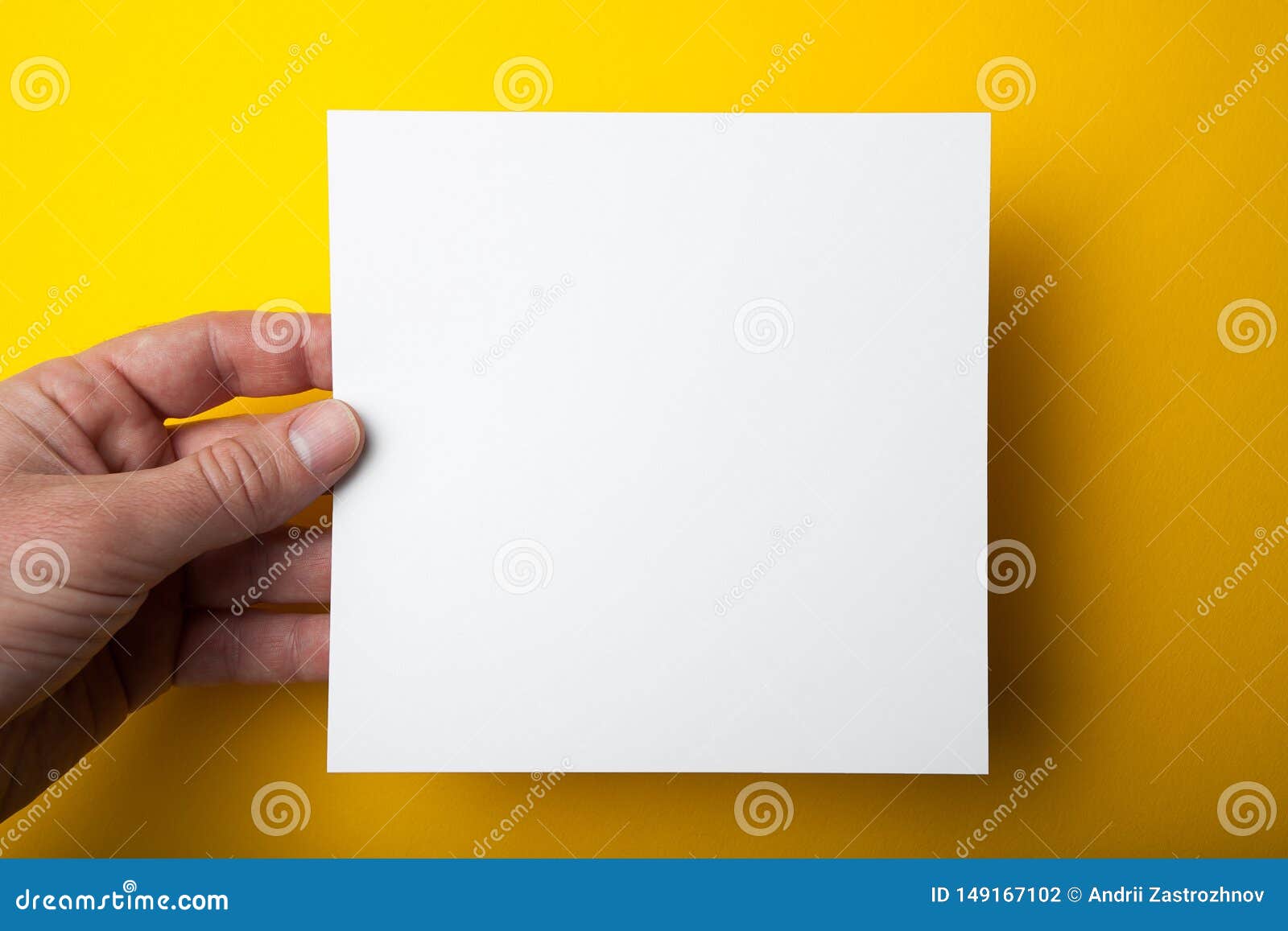 Empty Square Layout in Hand on a Yellow Background Stock Photo - Image ...