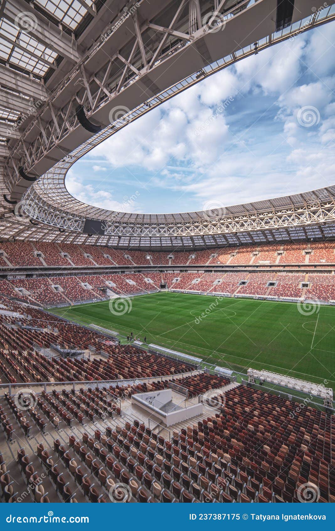 Empty Stadium and a Lots of Empty Seats, Green Grass on the Fields ...