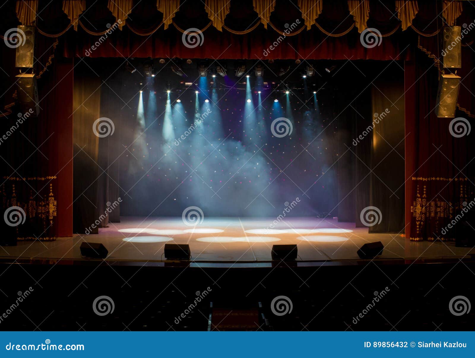 An Empty Stage of the Theater, Lit by Spotlights and Smoke Stock Photo ...