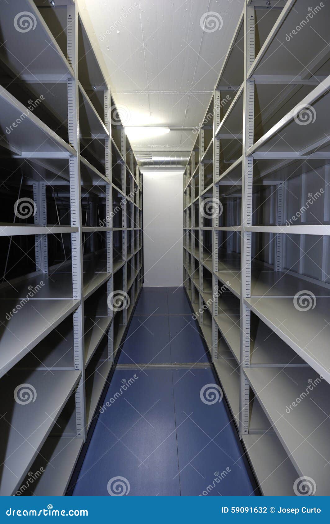 An Empty Storage Unit with Shelving Stock Photo - Image of city ...