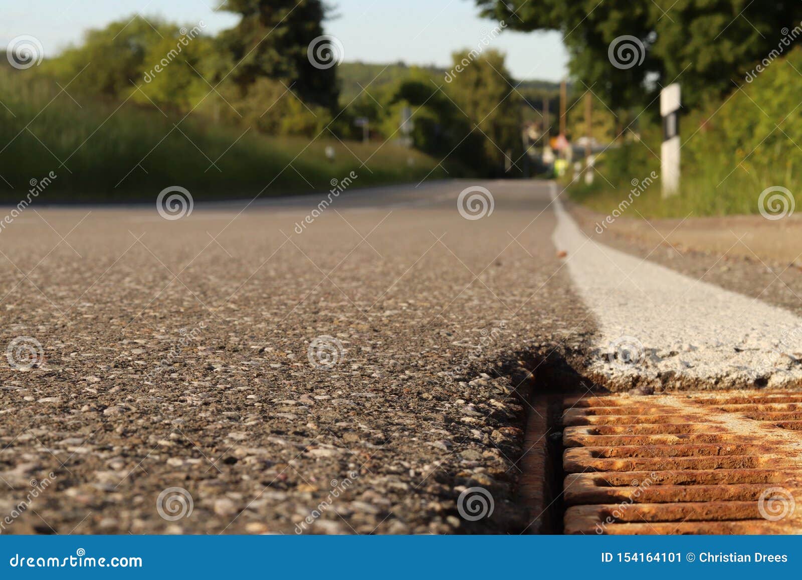 Empty Street with a Gully in the Front Stock Image - Image of green ...