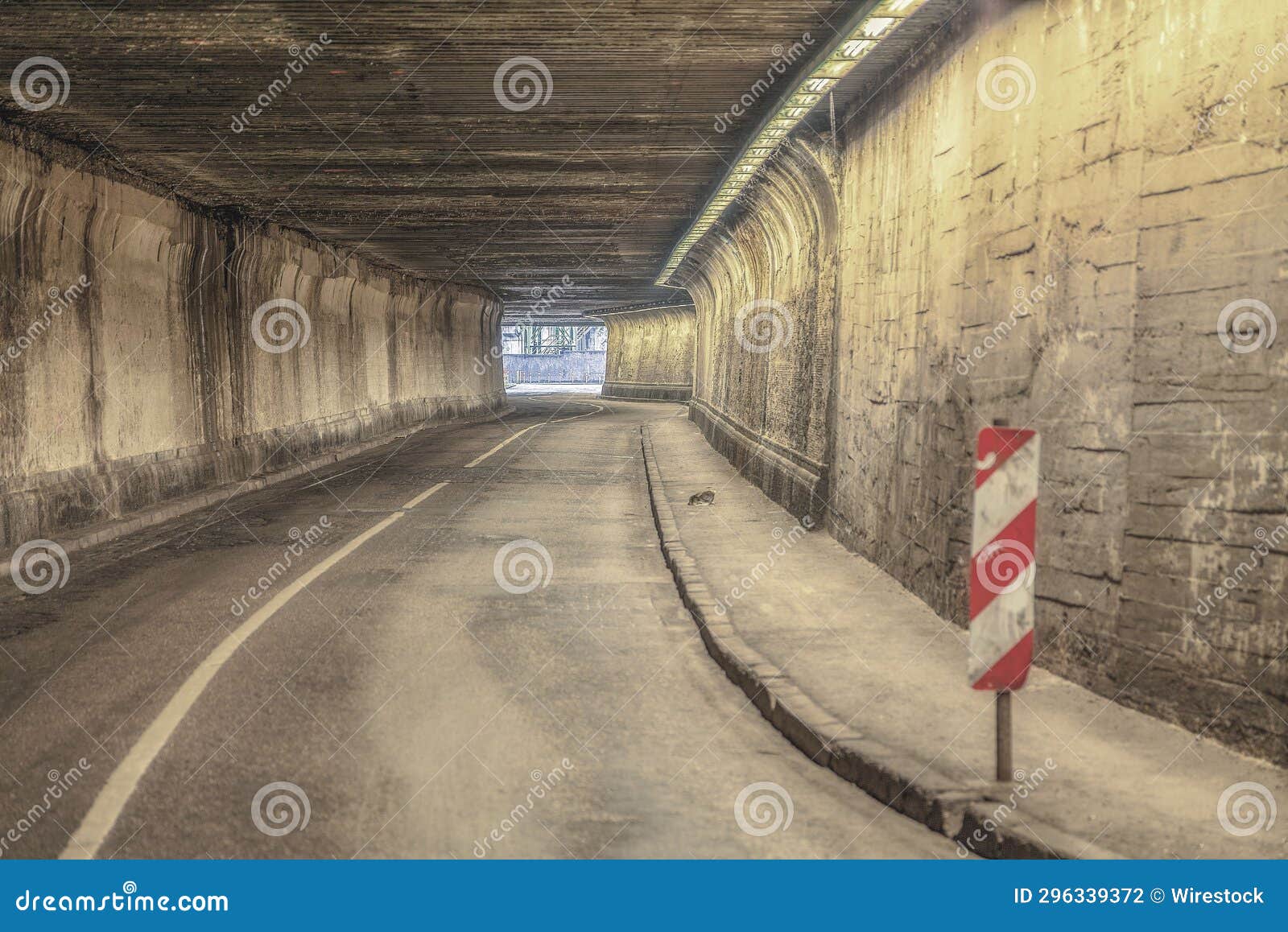 An Empty Street Surrounded by Concrete Walls in a Tunnel, Stock Photo ...