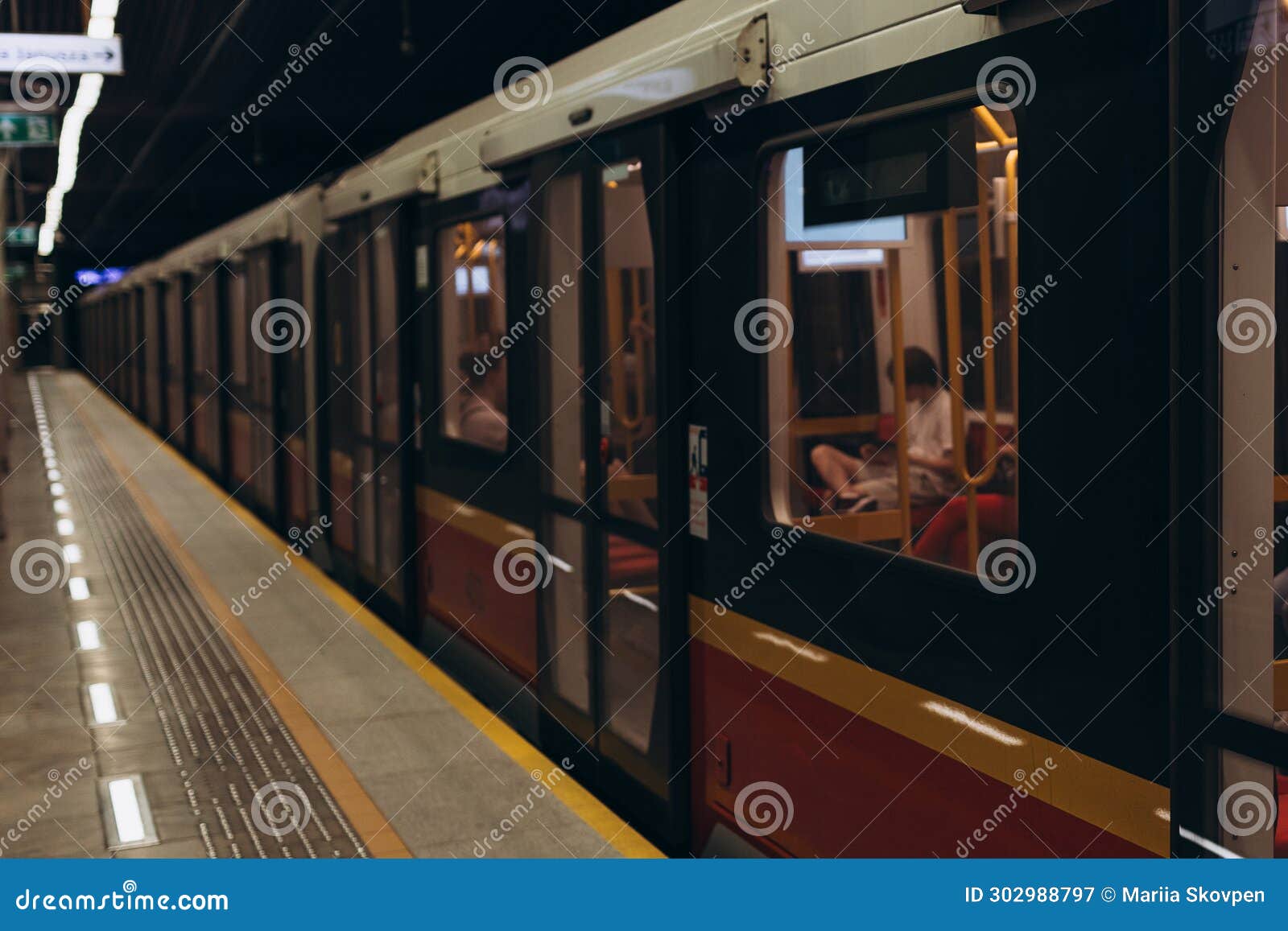 Empty Subway Station, Diminishing Red Train Leaving the Platform Stock ...