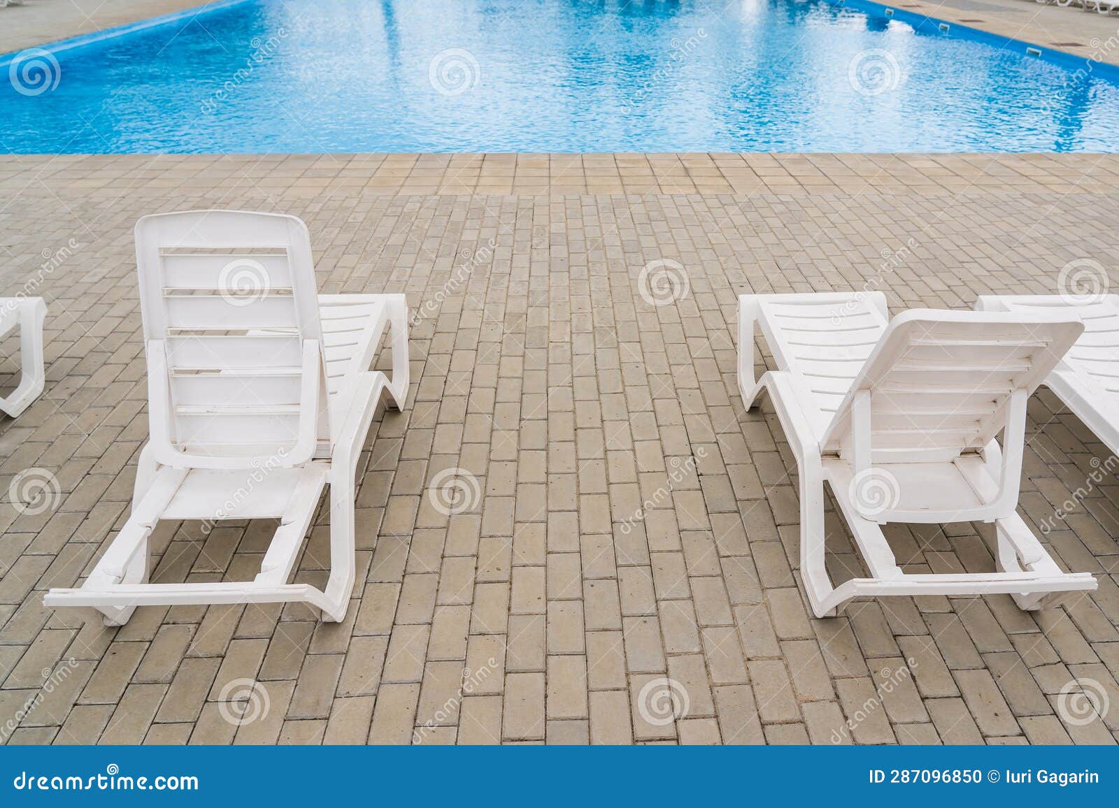 Empty Sun Loungers in the Resort Area by the Pool. Background with Copy ...