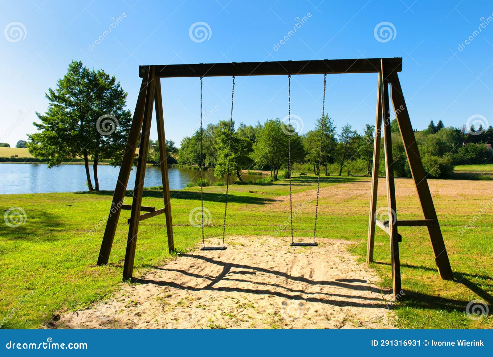 Empty swing in landscape stock image. Image of rope - 291316931