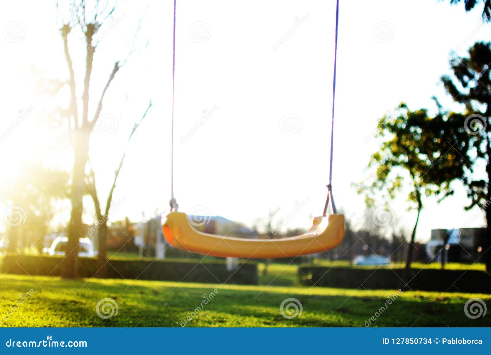 Empty swing in the park stock photo. Image of child - 127850734