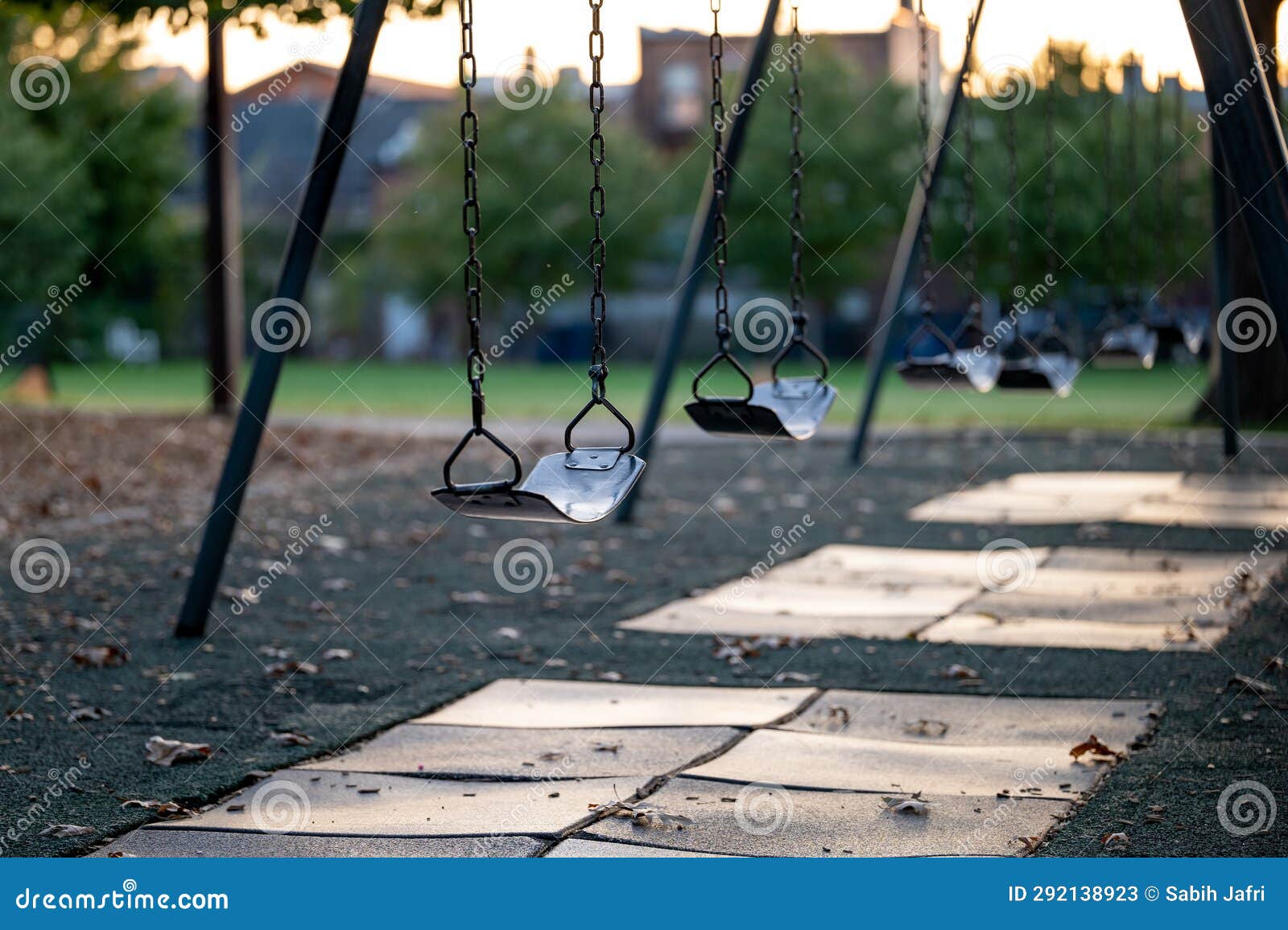 Empty Swing at a Playground at Sunset Stock Image - Image of urban ...