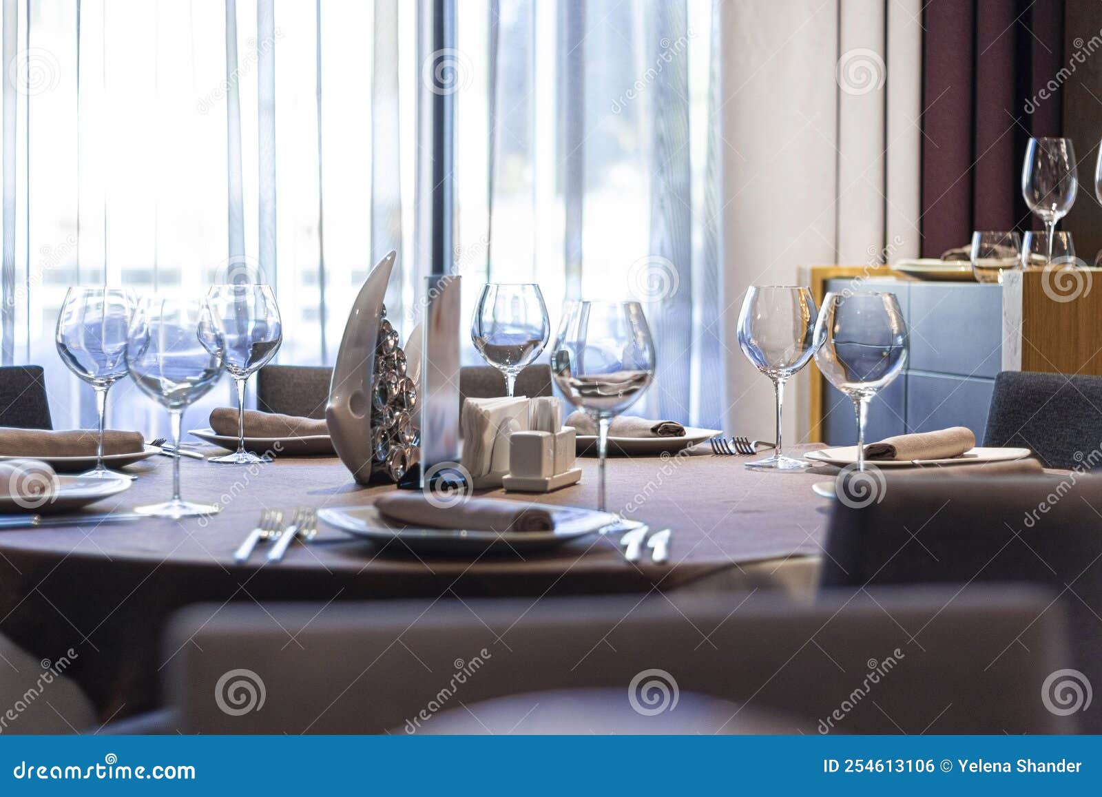 An Empty Table with Dishes in a Cafe or Restaurant Against the Backdrop ...