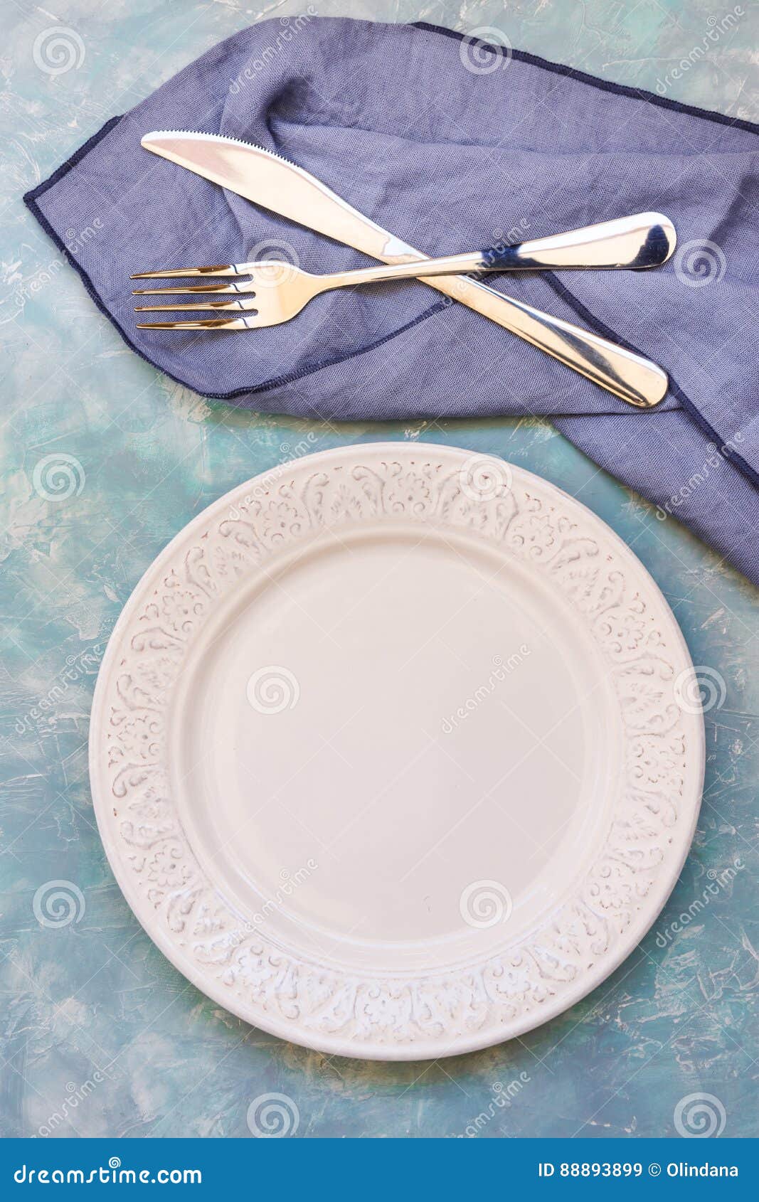 Empty Table Setting Arrangement, White Plate, Cutlery, Blue Napkin ...