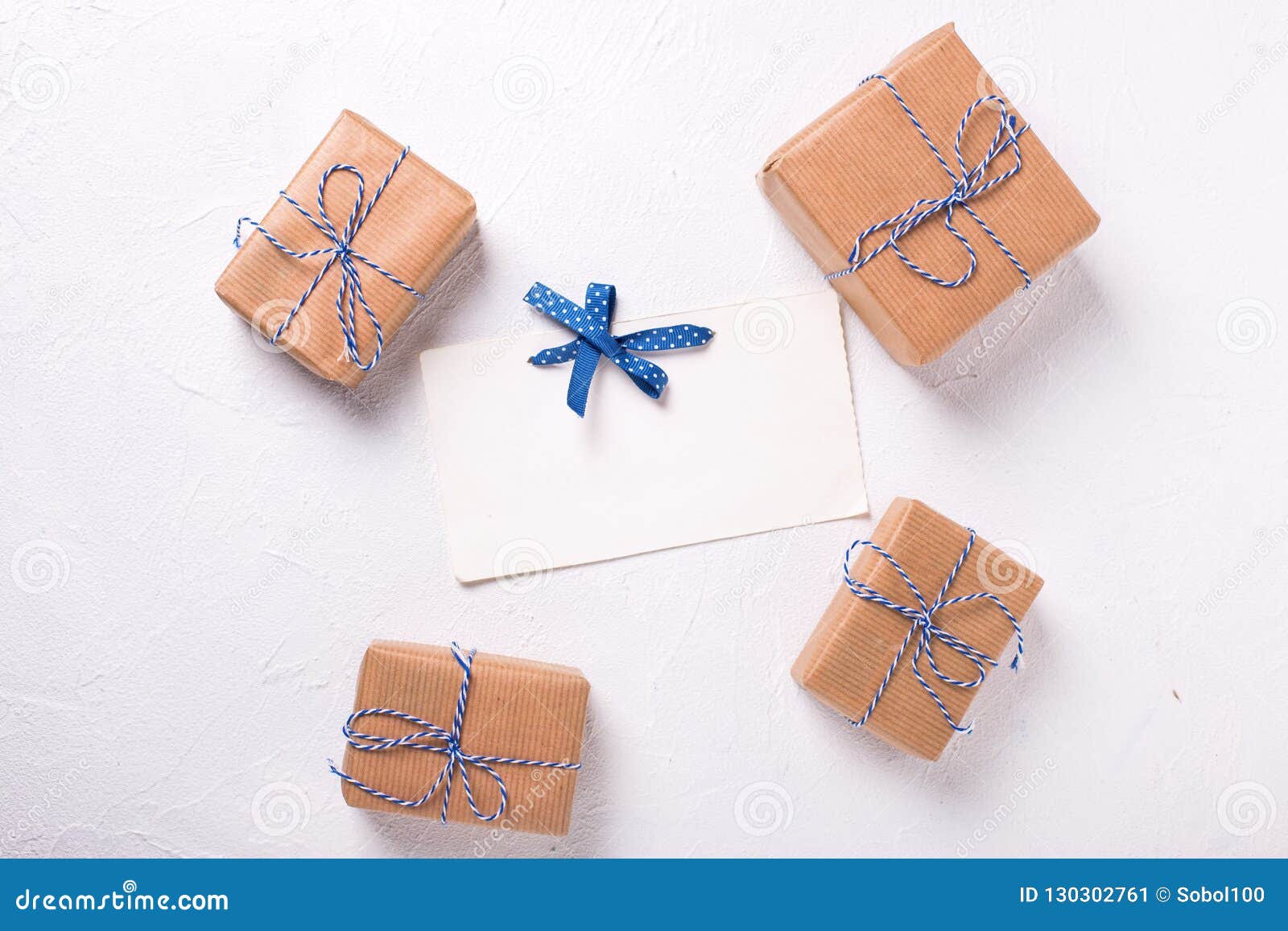 Empty Tag and Wrapped Gift Boxes with Presents on Textured Bac Stock ...