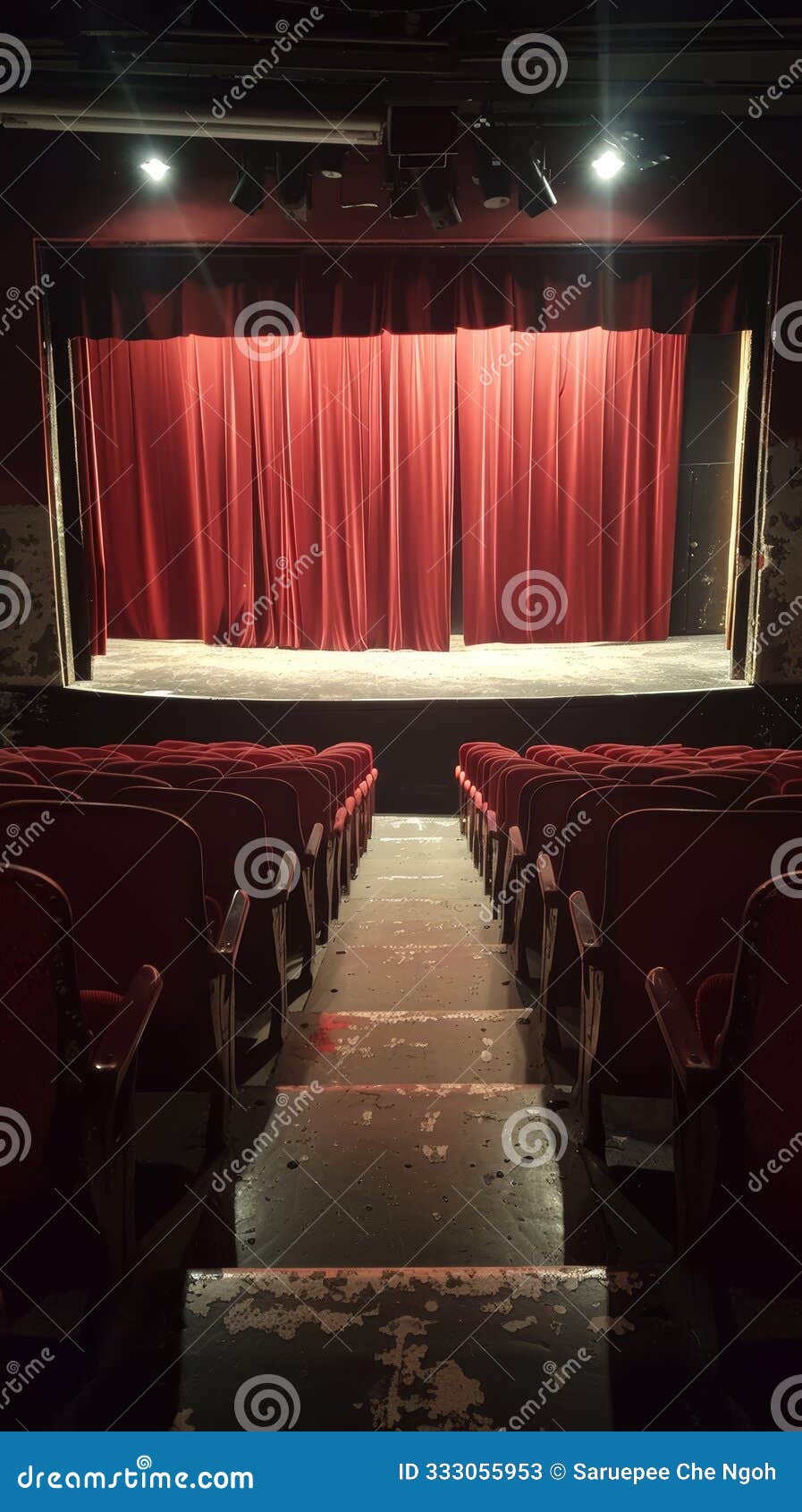 Empty Theater with Red Curtains and Rows of Seats in Dim Lighting Stock ...