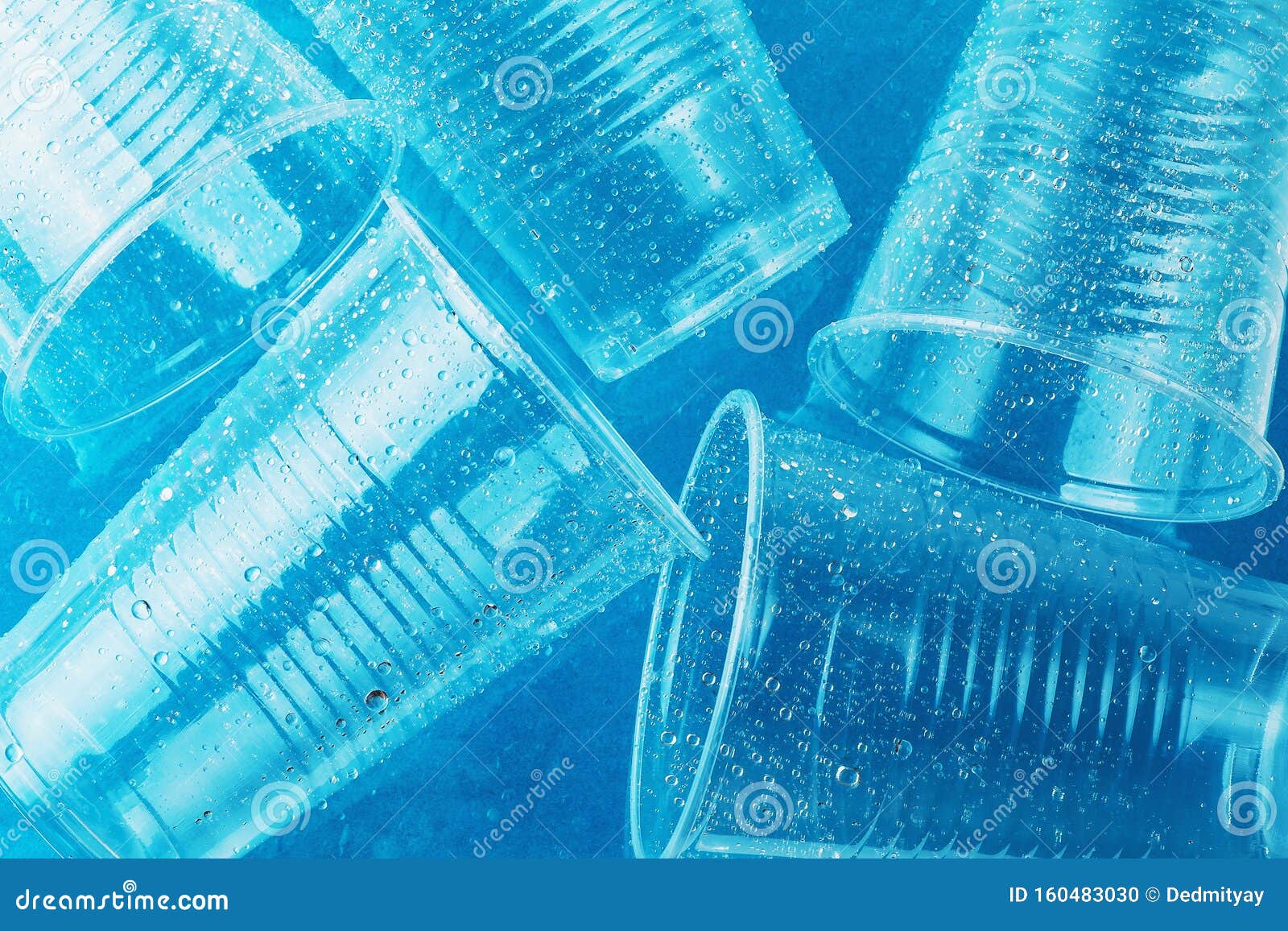 Empty Transparent Disposable Plastic Glasses in Drops of Water on ...