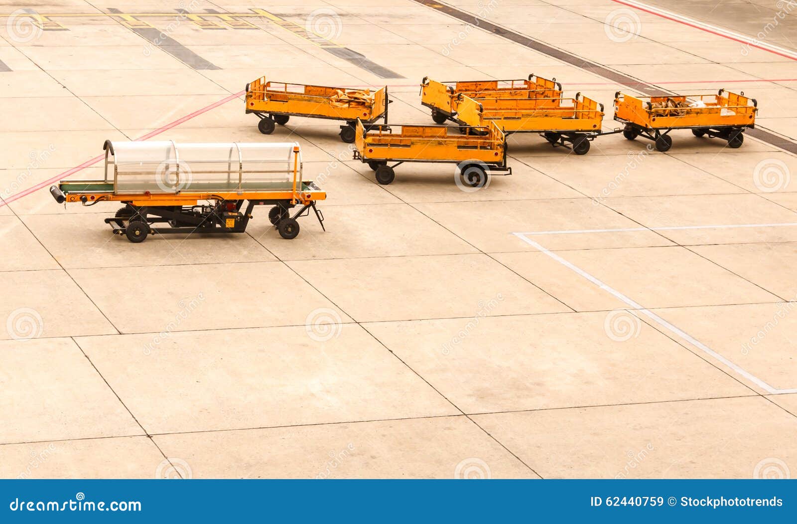 Empty Transporting Baggage Trailer To Airplane on Runway. Stock Image ...