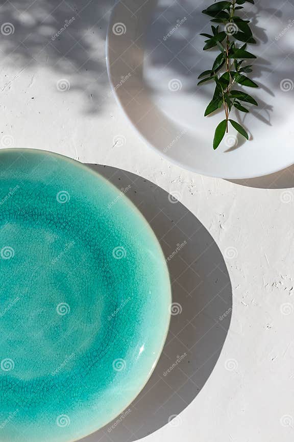 Empty Turquoise Ceramic Plate on White Plaster Background with Myrtle ...