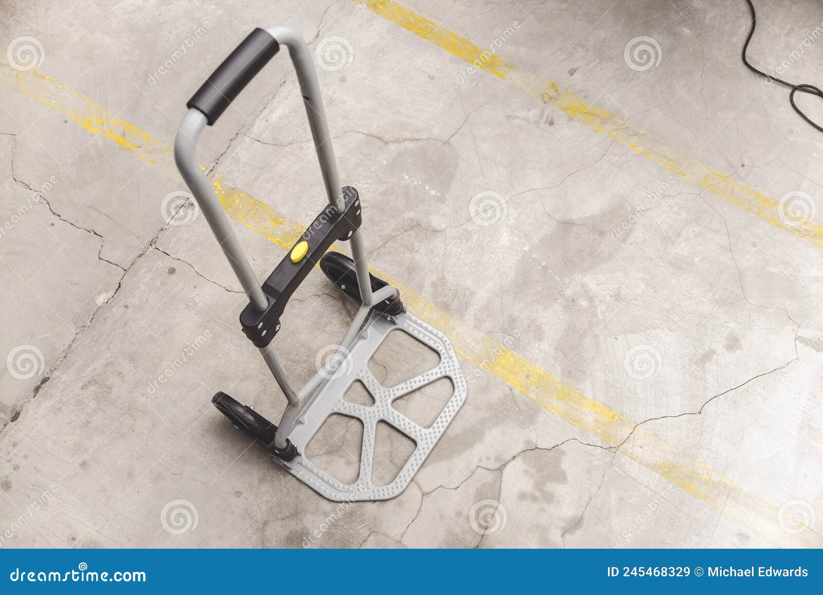 An Empty Two-wheel Foldable and Portable Trolley Upright on a Concrete ...