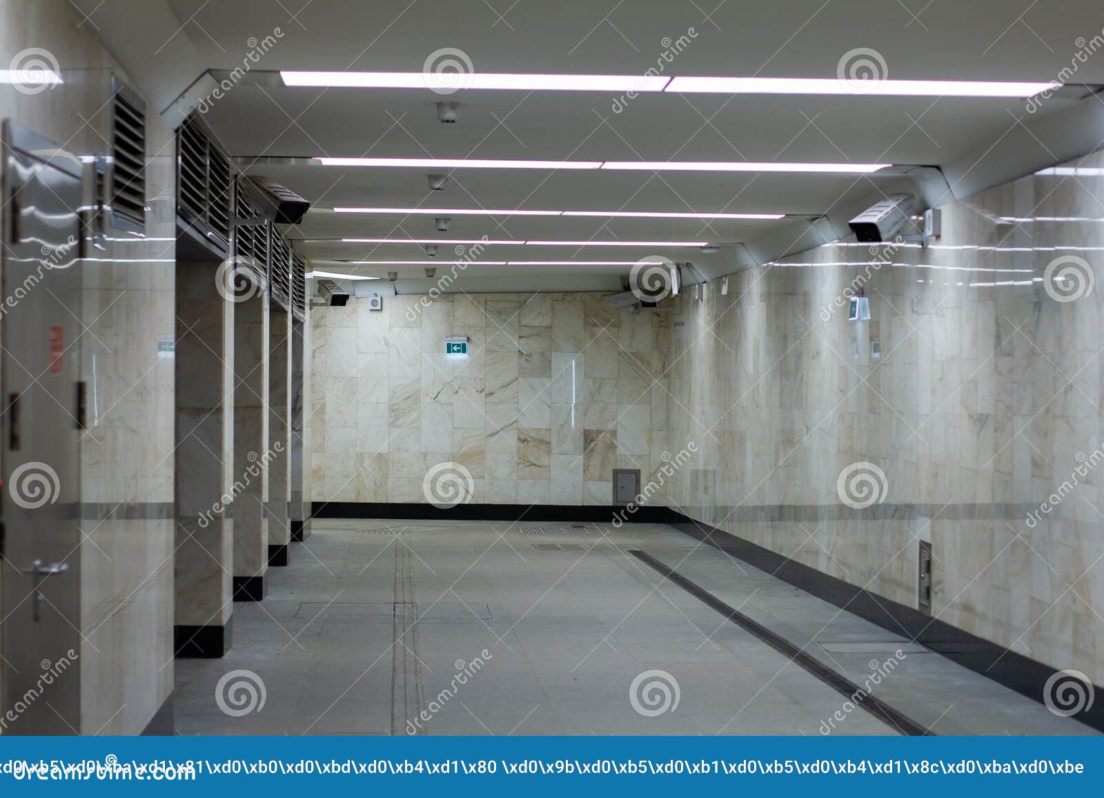 An Empty Underground Passage with Marble Walls, Bright Lighting ...