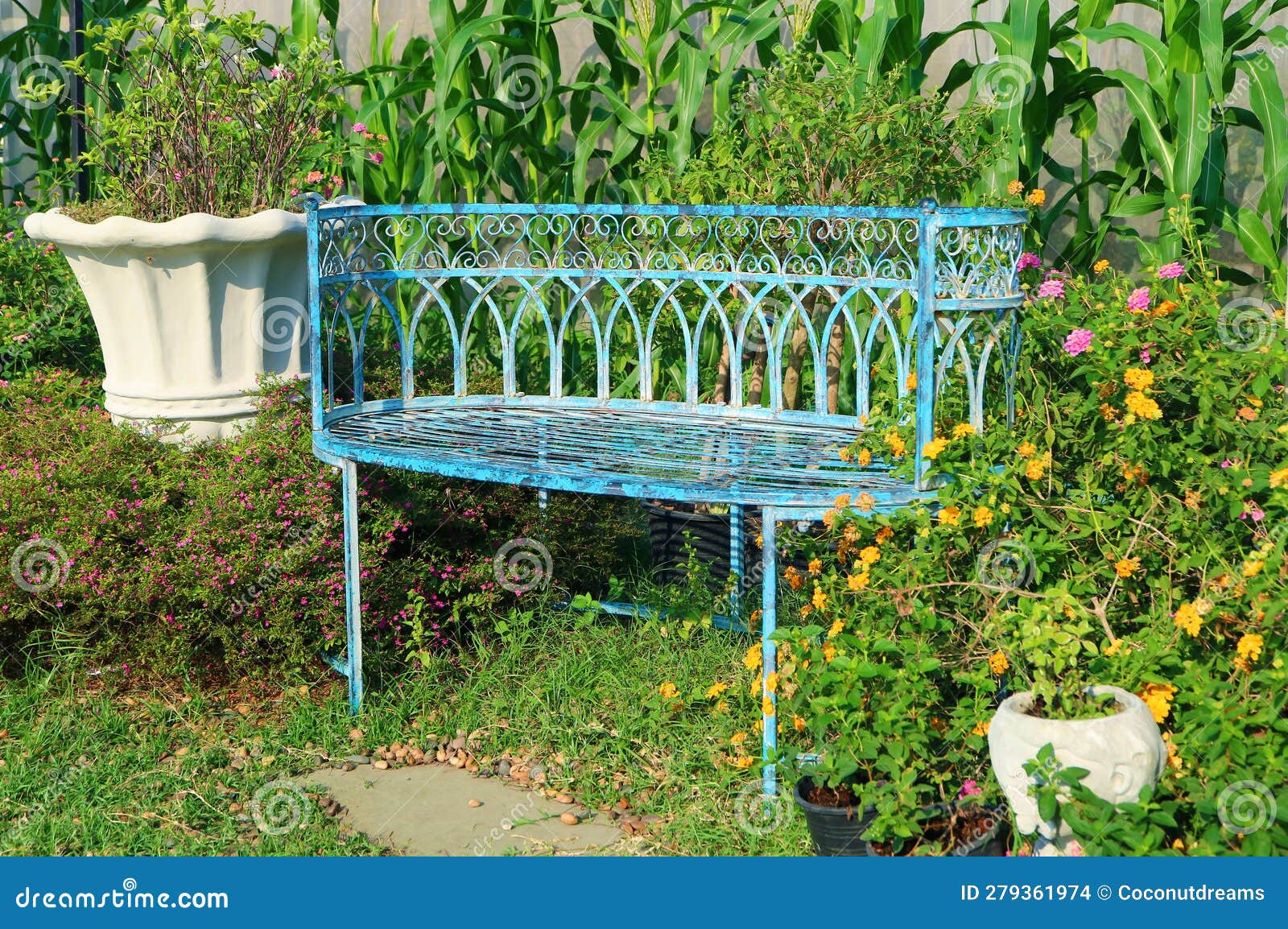 Vintage Blue Colored Wrought Iron Bench in the Garden Stock Photo ...