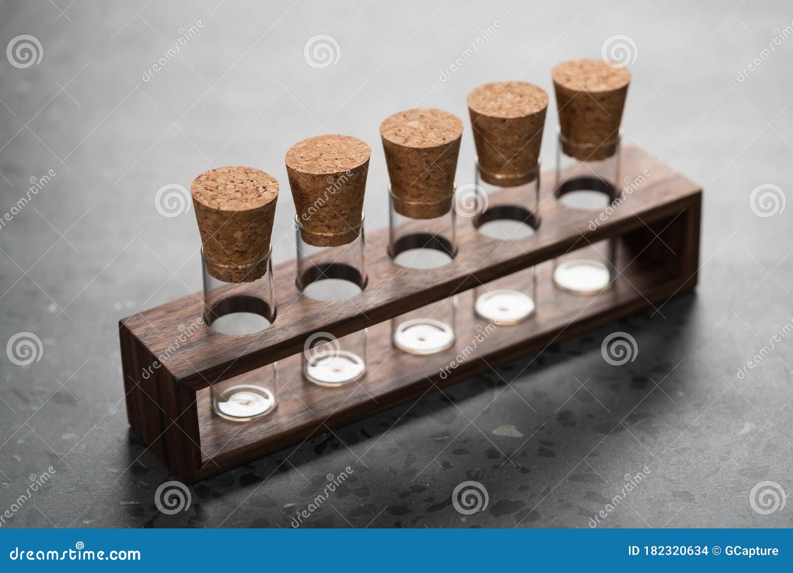 Empty Walnut Holder with Glass Tubes for Spices on Concrete Surface ...