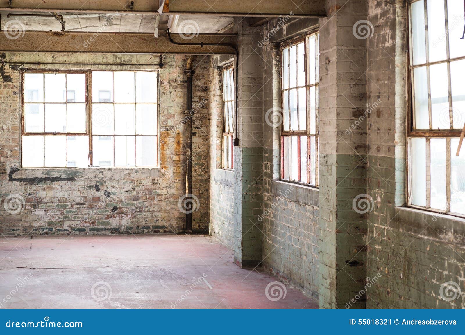 An Old Rundown Warehouse Wall With Two Wood Doors Royalty-Free Stock ...