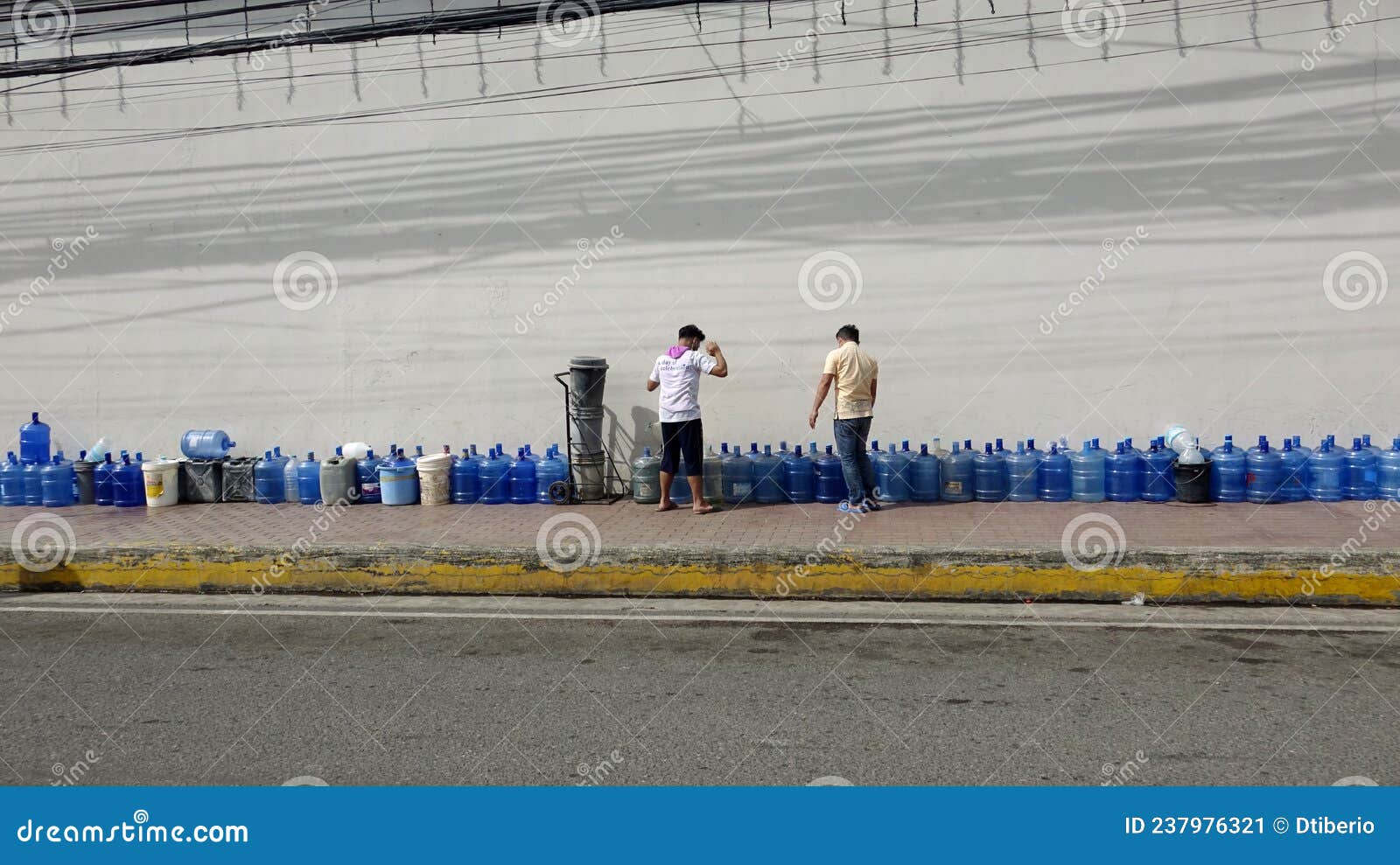 Empty Water Containers In Front Of A Water Refilling Station Editorial ...