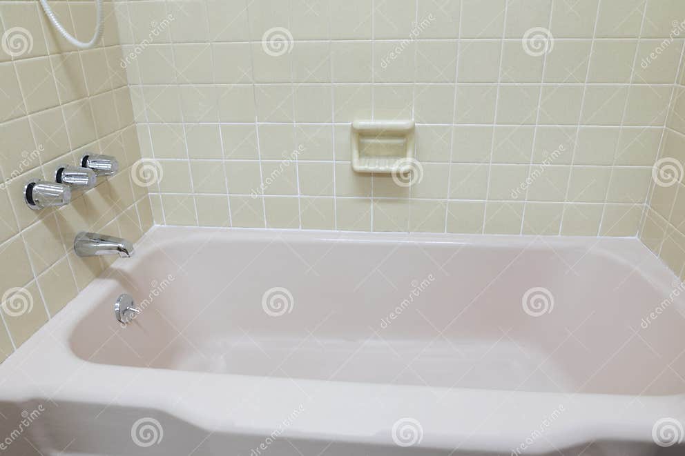 Basic Bathtub with Beige Tile Stock Photo - Image of faucet, beige ...
