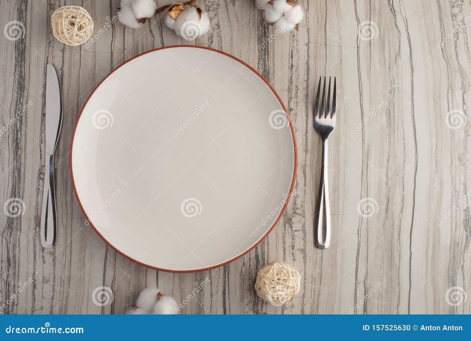 Empty White Dish with Knife and Fork on a Slate Background with a ...