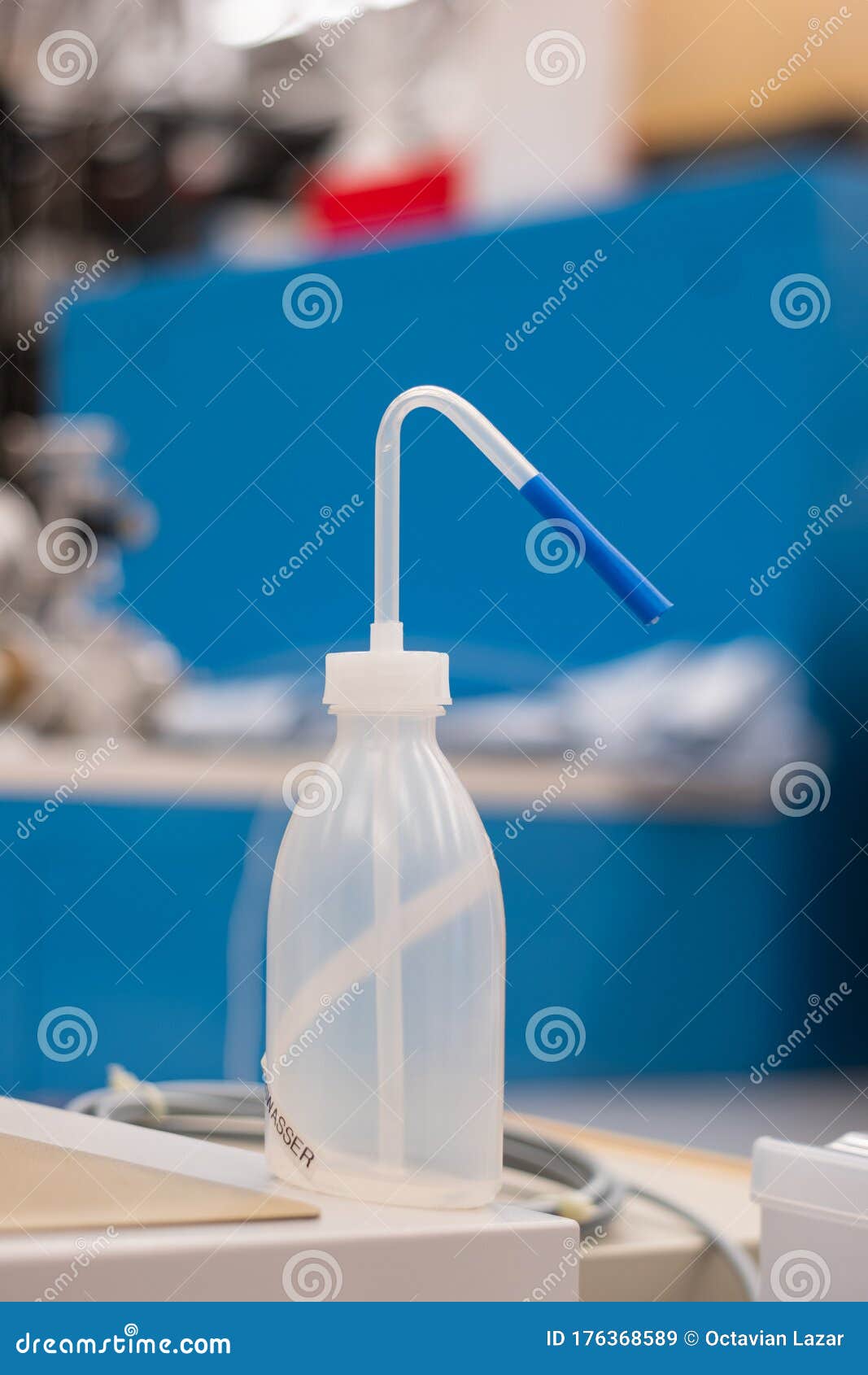 Empty White Plastic Squeeze Bottle with Tube Nozzle in a Lab Shallow ...