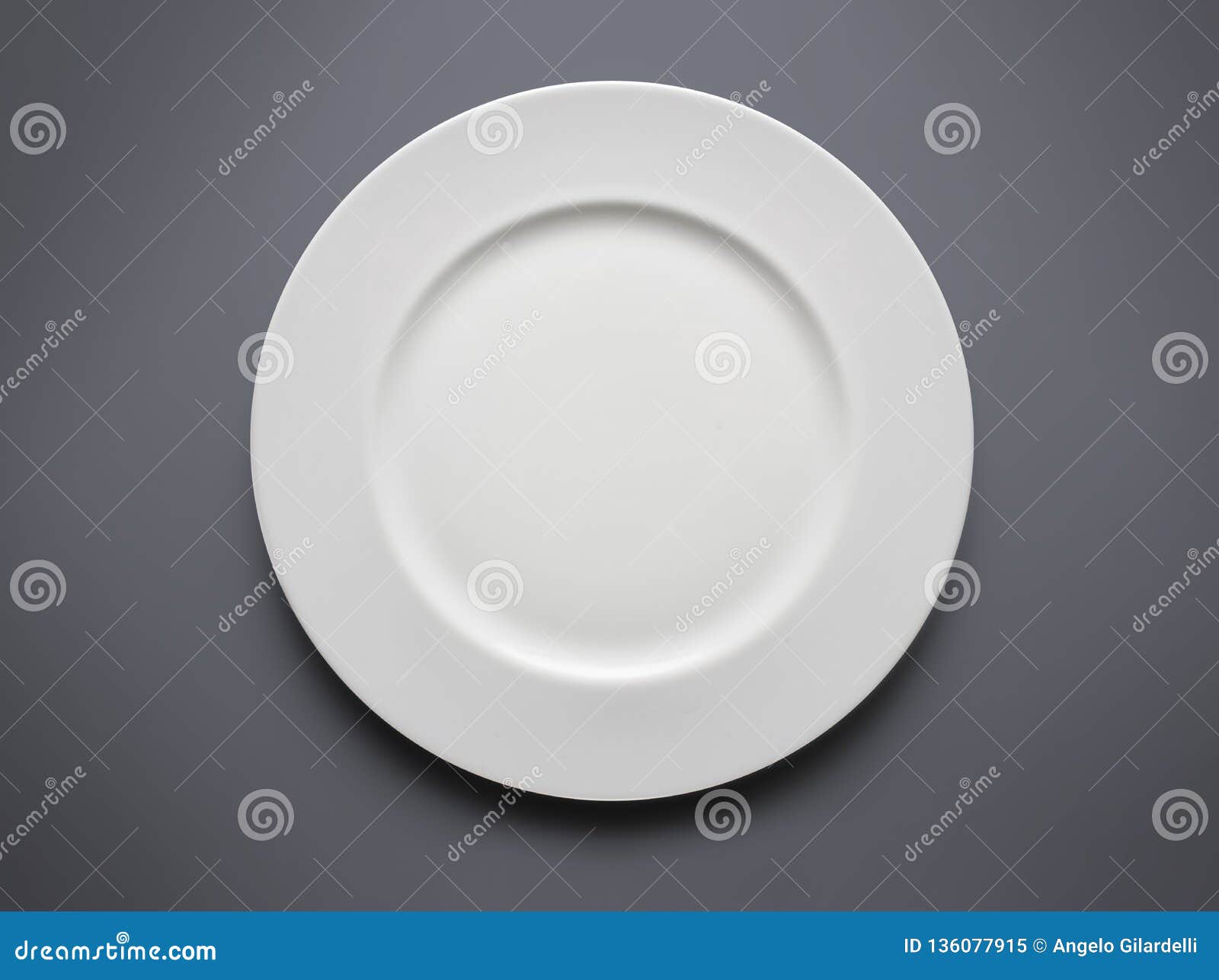 White plate from above stock image. Image of isolated - 136077915