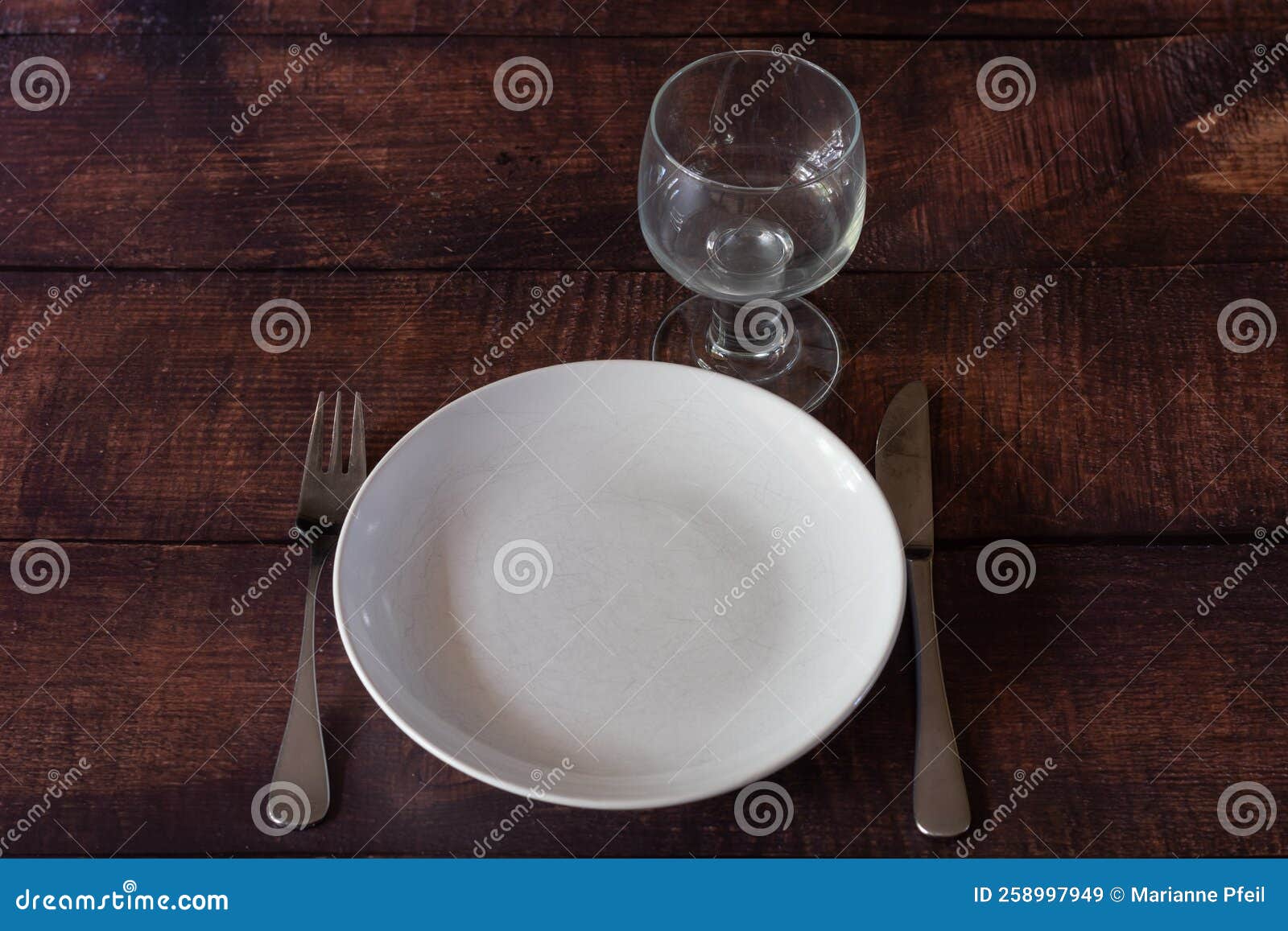 A Place Setting for One on a Rustic Brown Table Stock Image - Image of ...