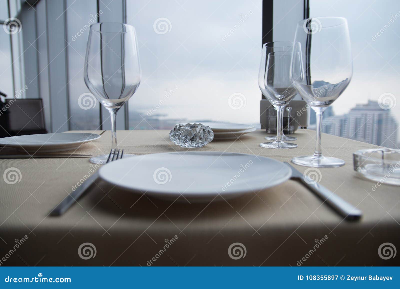 Empty White Plates on Table at a Restaurant with a Large Window View ...