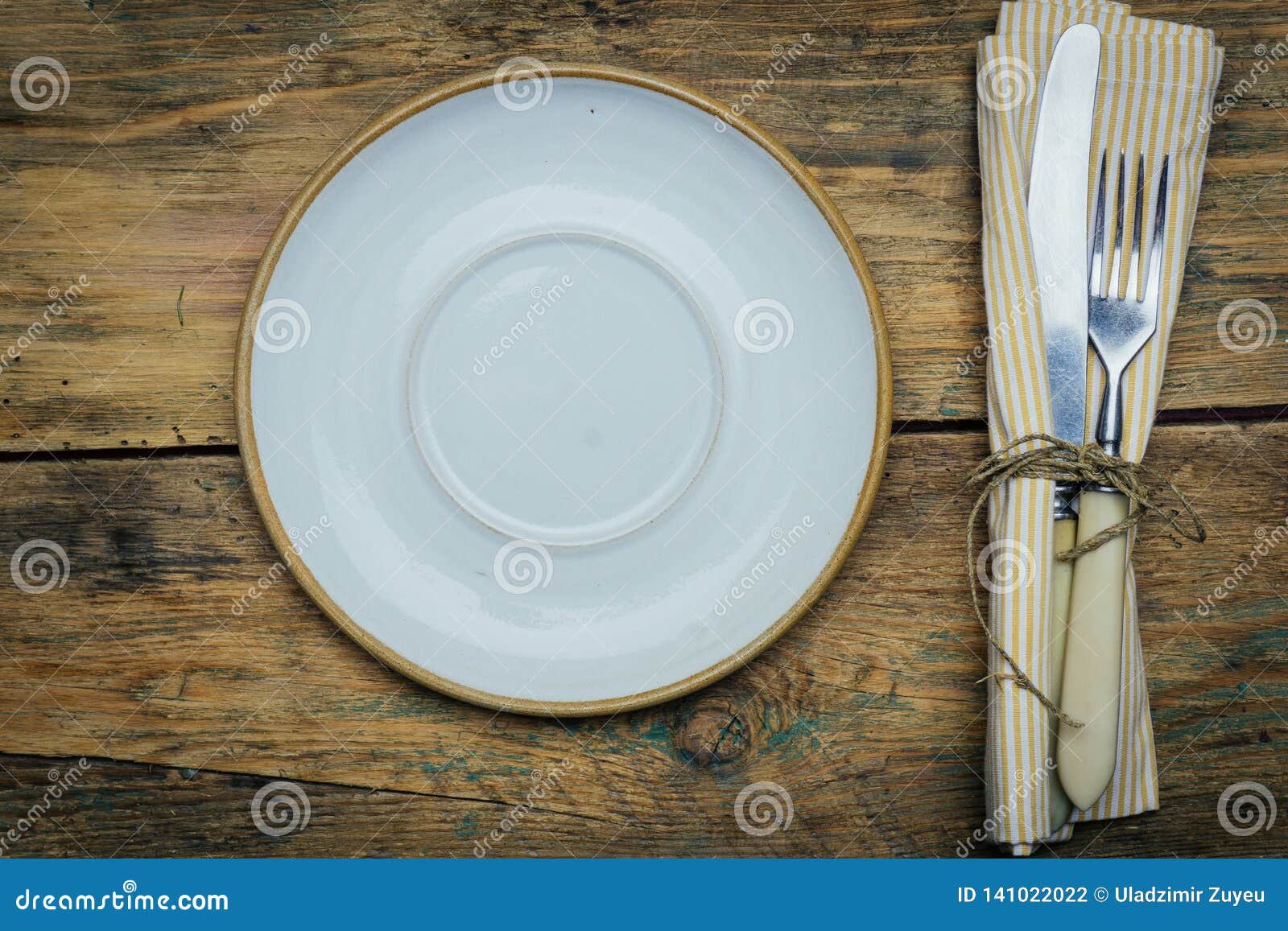 Empty White Rustic Plate on Old Wooden Background with Knife, Fork and ...